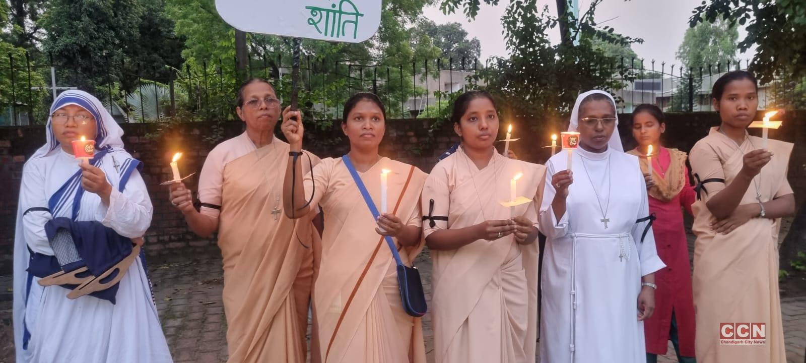 Candle light prayer service organized to express the solidarity with ...